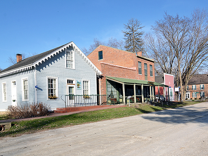 This peaceful Des Moines River scene captures the timeless magic of Iowa's smallest historic gem, where every building tells pioneer tales.