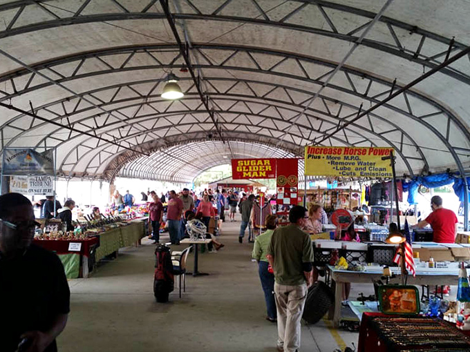 Beneath metal rafters, shoppers hunt for treasures while "Beer Here" signs remind you shopping is thirsty work.