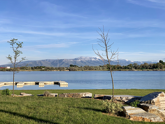 The serene waters near Burley reflect both the mountains and the reasonable cost of living. Nature's beauty comes complimentary with residence.