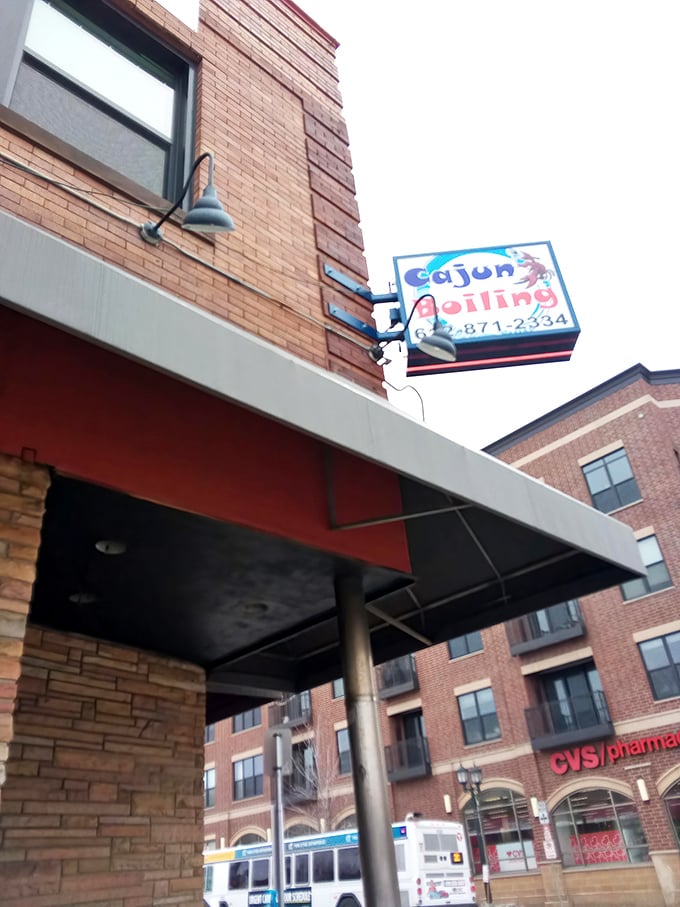 Cajun Boil's bright sign cuts through the Minneapolis night like a beacon for hungry seafood lovers.