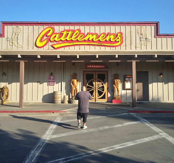The iconic yellow Cattlemen's sign has been guiding hungry travelers to steak satisfaction for generations.