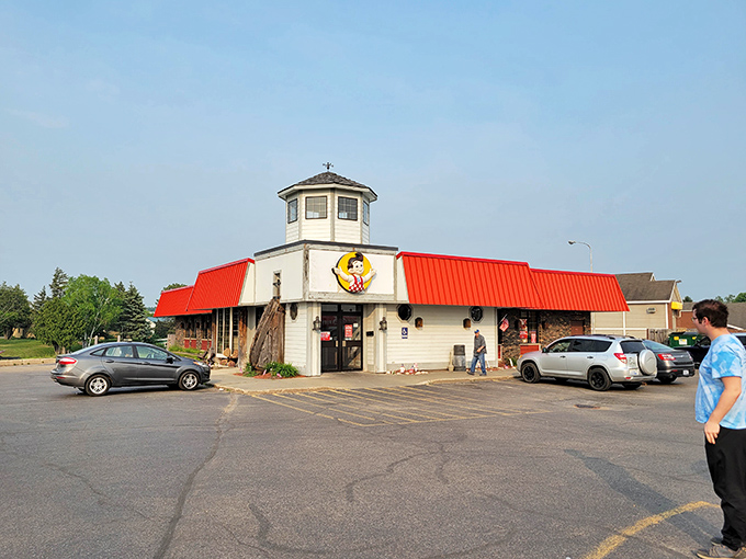 A local restaurant with a bright red roof stands ready to serve in Cheboygan. Good food in affordable towns is never a bad deal.