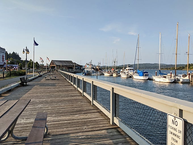 The wooden boardwalk at Coos Bay's harbor invites visitors to watch fishing boats and breathe in the refreshing ocean air.