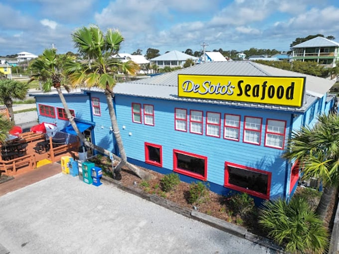 Those palm trees and colorful walls create the perfect backdrop for some seriously delicious coastal cuisine.