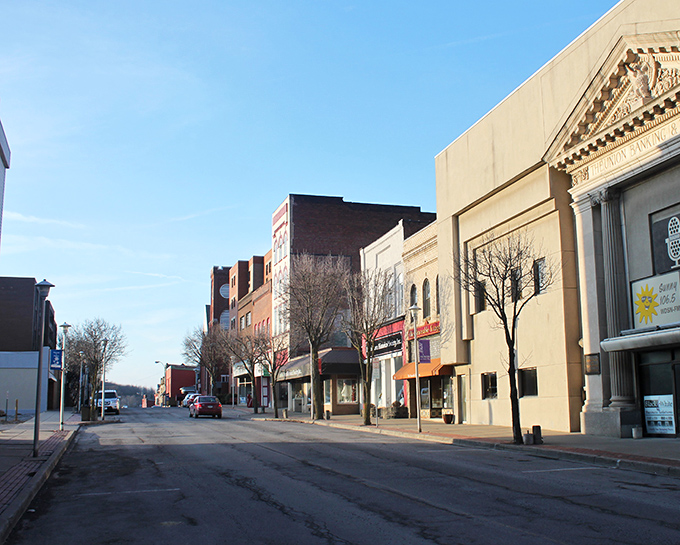 The warm light bathes DuBois' main street, highlighting affordable living spaces with vintage charm. Like finding a perfectly preserved mid-century modern chair at a rural estate sale!