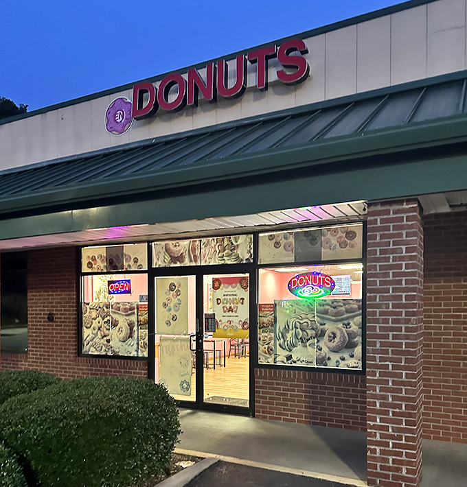 The evening glow through EN Donuts' windows reveals the secret laboratory where tomorrow's breakfast happiness is being created.