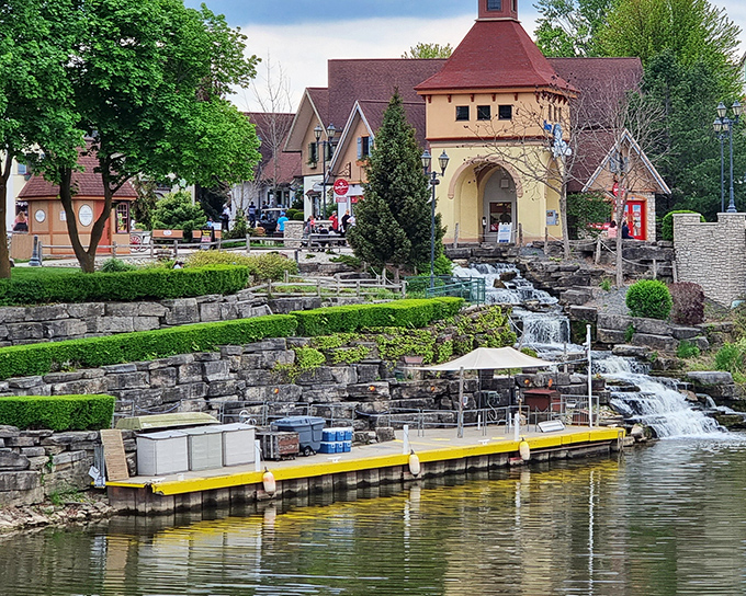 Stone waterfalls cascade through manicured landscapes in this Alpine-inspired village, where even the infrastructure looks like it belongs in a European postcard.