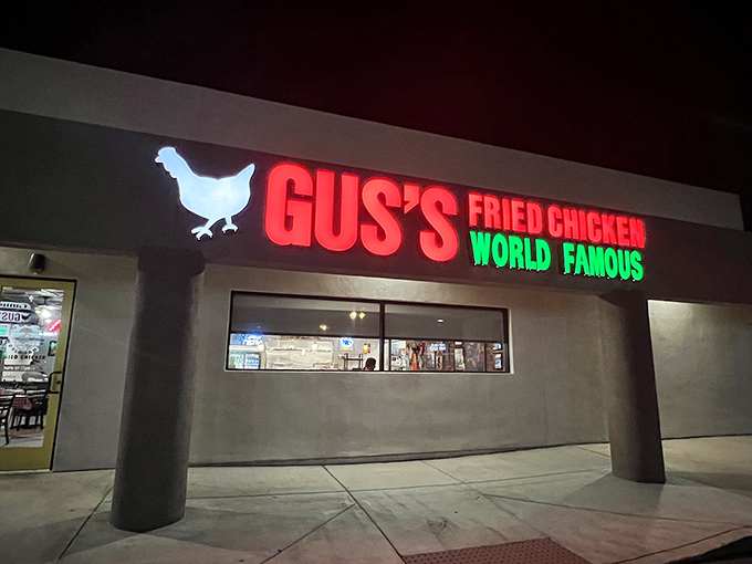 When the sun goes down, Gus's neon chicken sign lights up like a beacon for crispy poultry pilgrims.