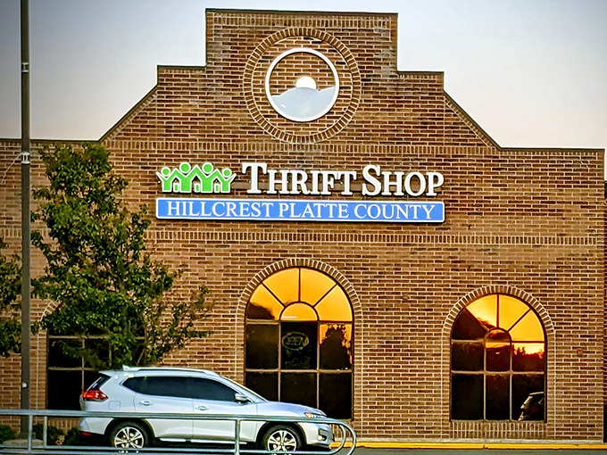 Sunset gleams off Hillcrest's windows, transforming this brick beauty into a cathedral of thrift. Even the building knows it's special!