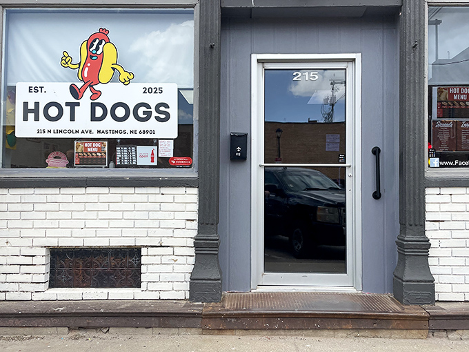 The unassuming entrance to Hot Dogs hides delicious treasures within. That cartoon hot dog knows what you're craving!