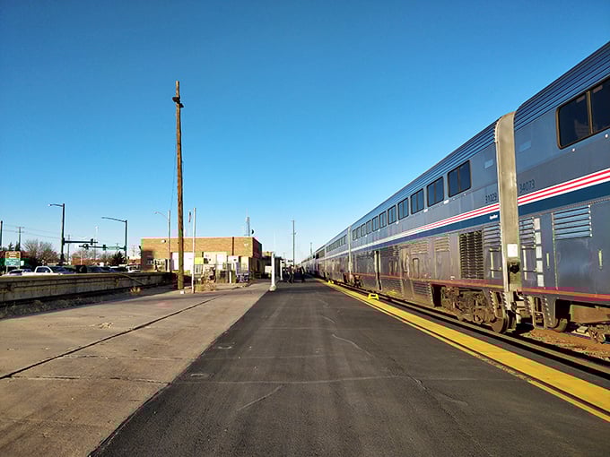 Travelers arrive in La Junta as sunlight warms the platform, capturing the timeless beauty of train journeys through Colorado&rsquo;s plains.