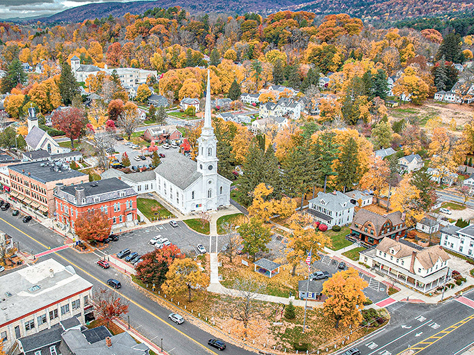 Autumn's golden crown! Lee's white-steepled church presides over a town where fall colors are free but rent leaves plenty of green in your wallet.