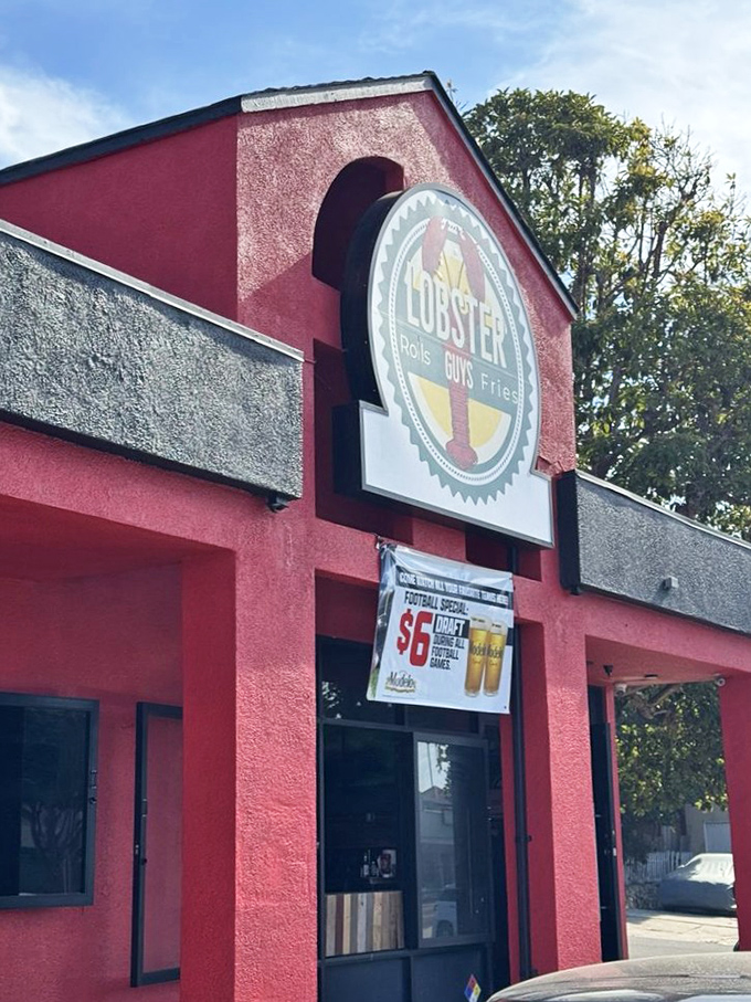 The vibrant red exterior of Lobster-Guys matches the passion they put into their rolls. That football special sign promises a winning combination!