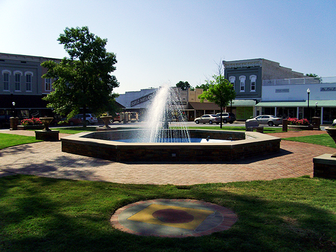 Monticello's town square fountain dances in the sunlight, creating the perfect spot for afternoon contemplation.