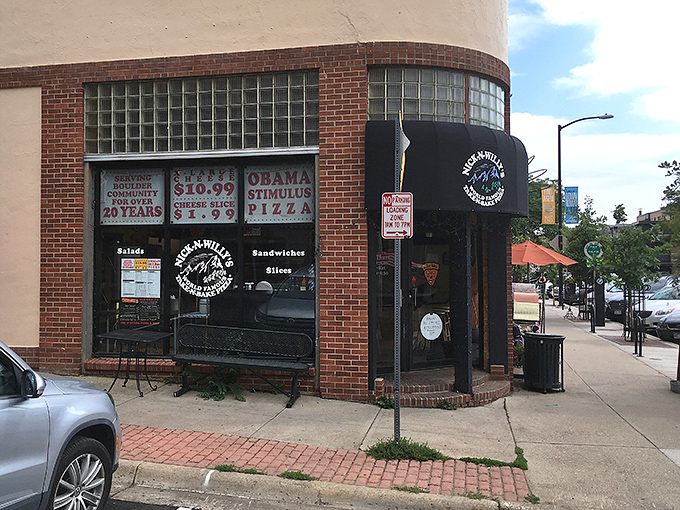 Pearl Street's vibrant energy flows through these welcoming windows where fresh pizza meets Boulder spirit.