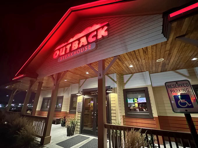 Neon-lit evening atmosphere promises consistent steaks and that famous Bloomin' Onion experience.