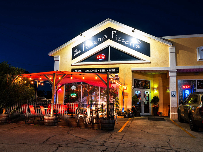 By night, this place transforms into a twinkling pizza paradise. The string lights create the perfect ambiance for debating important topics like "Is pizza better than birthday cake?"