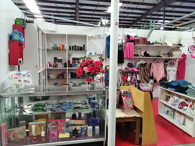 Inside Peddler's Pavilion, neatly organized vendor spaces offer everything from perfume to pink dresses.