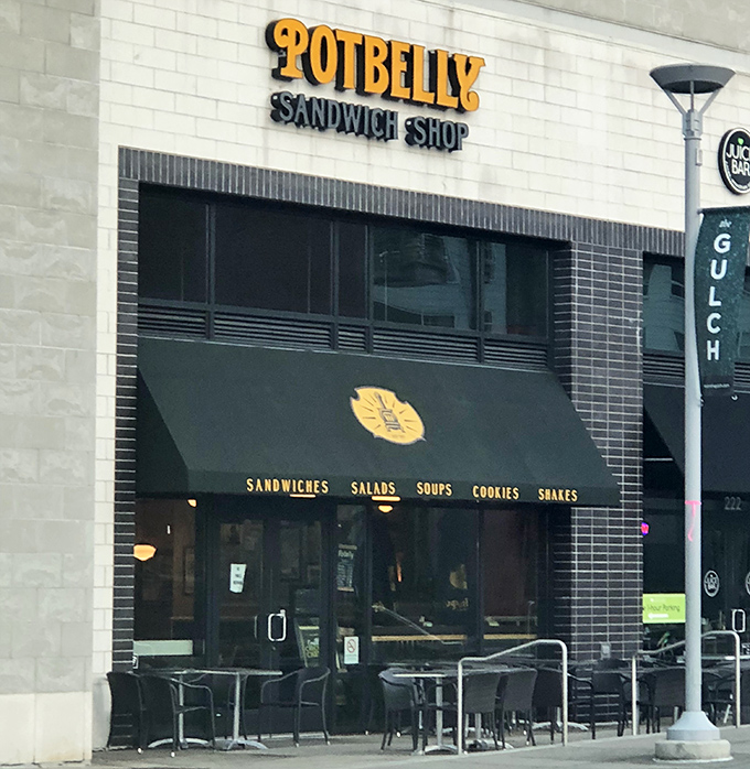 The cozy outdoor seating at Potbelly is perfect for enjoying their famous toasted sandwiches while watching the world go by.