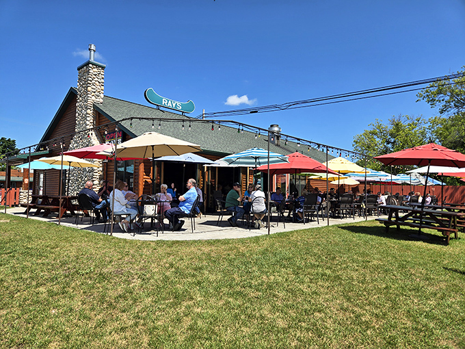 Colorful umbrellas and rustic logs create the perfect blend of comfort and North Woods charm.