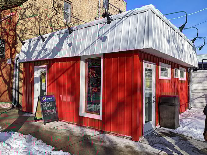 Winter can't stop Chicago's chicken pilgrims. Red Light's cozy shack glows with promise against the snow &ndash; crispy salvation awaits inside.