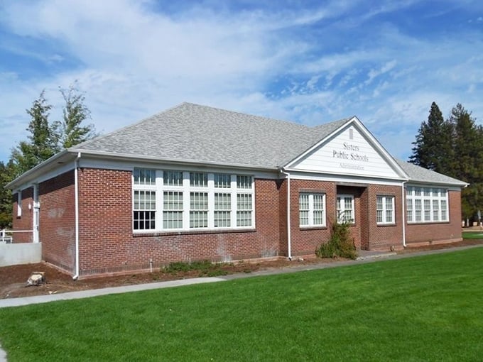 This charming brick school building stands proudly, reminding everyone that good architecture never goes out of style.