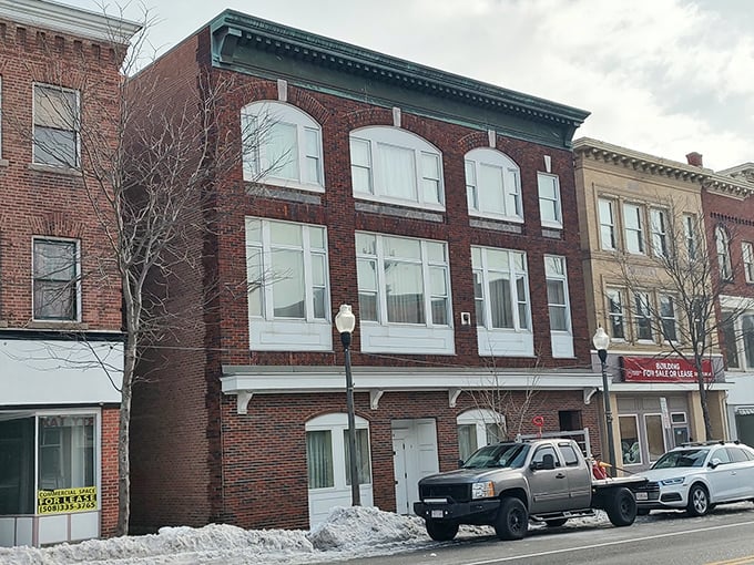 Historic brick facades and snow-dusted sidewalks capture the quiet charm of Southbridge&rsquo;s Main Street in winter.