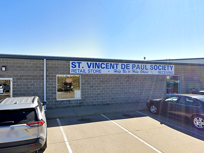 Simple blue and white signage promises the kind of finds that make thrift shopping addictive.