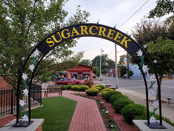 Sugarcreek welcomes you with a floral archway that practically sings "your retirement dollars stretch further here!" Small town magic with big savings.