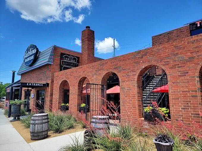 Hutchins combines rustic charm with BBQ seriousness. Those brick arches frame a pathway to smoked meat paradise.