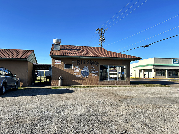 Classic barbecue joint architecture with a playful twist - that cartoon pig knows what's cooking inside.