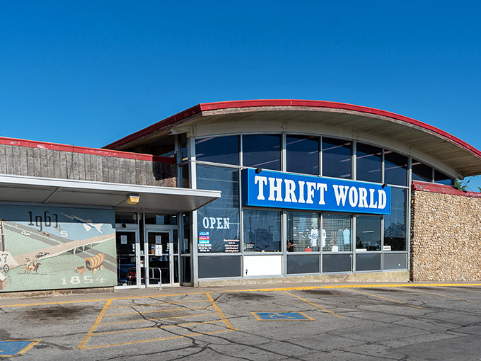 The retro-futuristic building design stands out against the blue sky&mdash;a landmark for generations of Omaha bargain hunters.