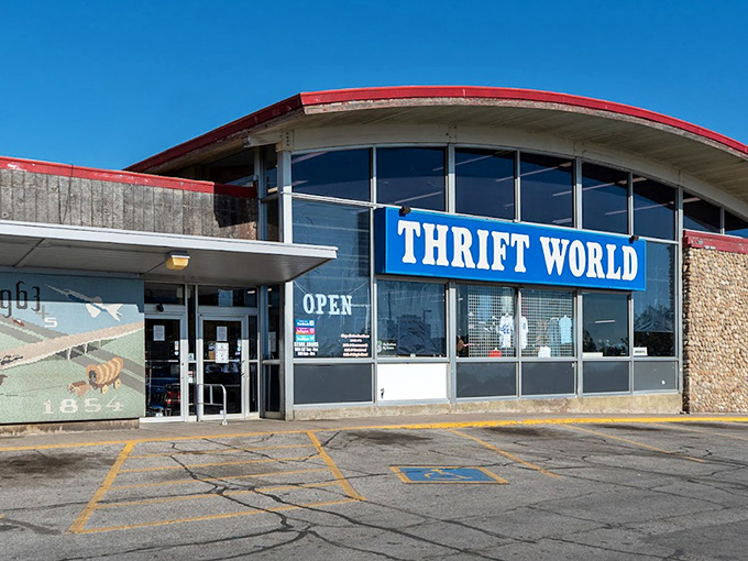 The distinctive red-trimmed windows of Thrift World frame a view into a wonderland of secondhand surprises.