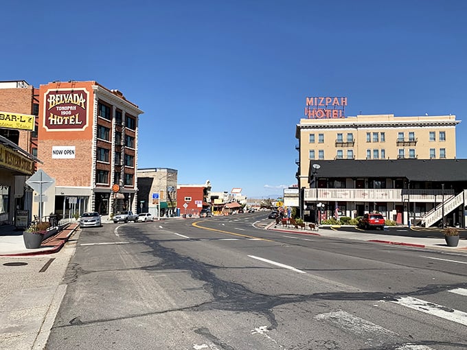 Downtown stretches beneath mountain views where gas stations and diners remember that customers deserve fair prices daily.