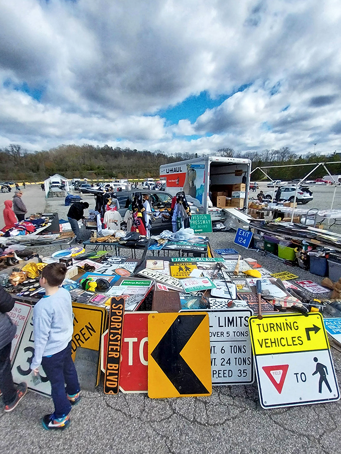 Street signs point to the past. This vendor's colorful collection of road signs would make any man-cave decorator stop in their tracks.