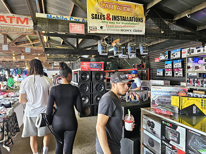 Speakers, screens, and shoppers fill the aisles at US 1 Metro, where technology bargains attract a diverse crowd.