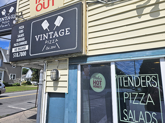 That cheerful exterior promises the kind of neighborhood pizza that keeps locals coming back for more.