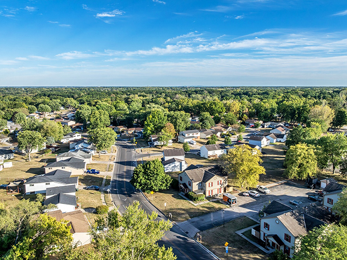 A peaceful neighborhood where tree-lined streets and open skies create a postcard-perfect slice of small-town life.