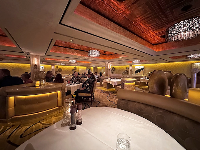 Rich textures and warm lighting create the perfect steakhouse atmosphere - elegance doesn't need to shout.