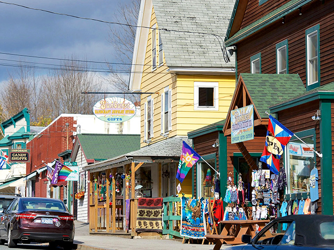 Colorful storefronts line this charming street like a rainbow of local businesses, each one adding personality to the neighborhood.