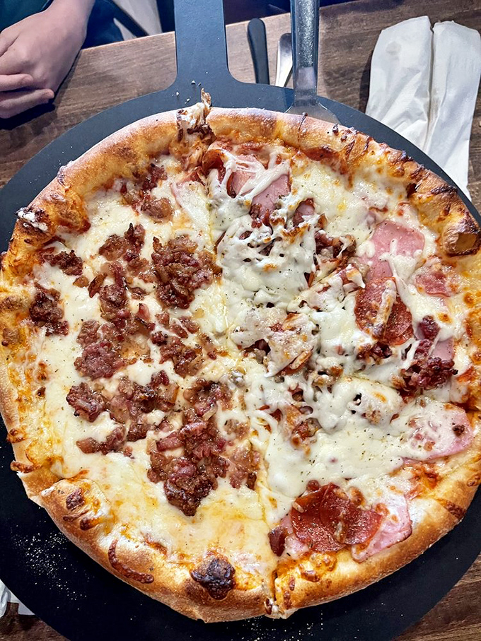 The carnivore's dream: a pizza that doesn't apologize for its meaty abundance but celebrates it with melty, cheesy fanfare.
