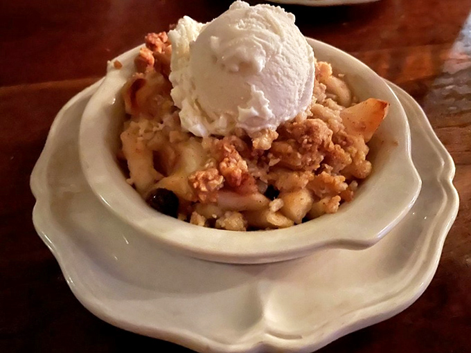 Warm apple crisp topped with ice cream &ndash; because some traditions shouldn't be messed with.