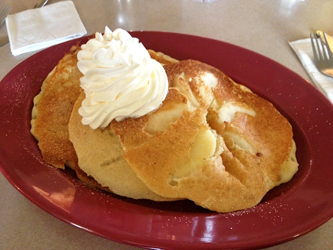 Apple cake topped with whipped cream brings dessert-level joy to any meal, because life's too short for boring endings.