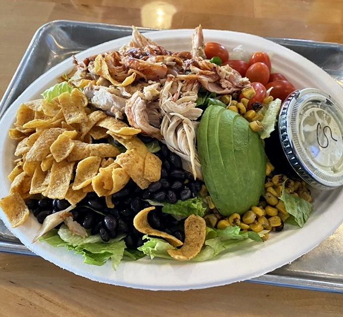 A salad that meat-lovers actually crave – where pulled chicken, avocado, and crunchy tortilla strips make eating greens feel like cheating.