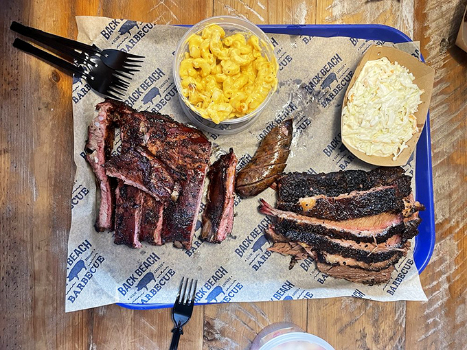 A barbecue platter that makes choosing unnecessary&mdash;ribs, brisket, and two sides that'll have you planning your next visit before finishing this one.