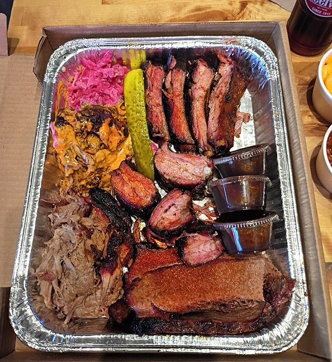 The barbecue sampler that makes decisions unnecessary. Why choose between brisket, pulled pork, and ribs when you can have the holy trinity?