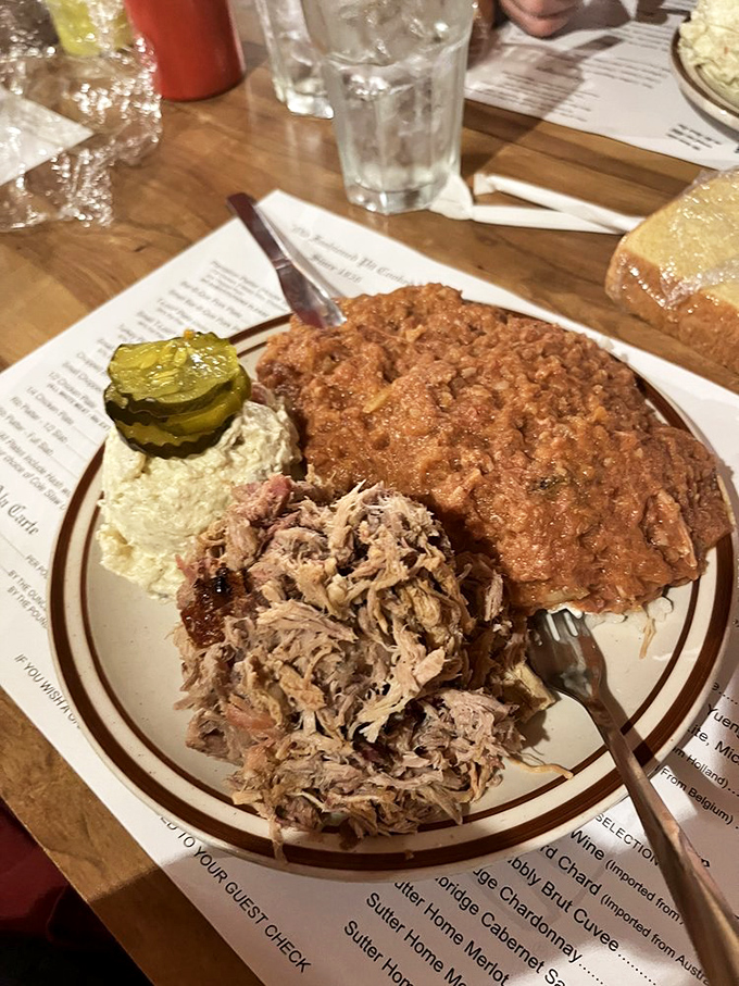 The pickle chips aren't just garnish—they're the acidic counterpoint in this barbecue symphony of textures and flavors.