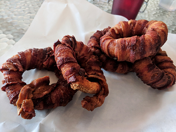 Bacon-wrapped onion rings – because sometimes regular onion rings just aren't indulgent enough. The kind of dish that demands to be shared on social media.
