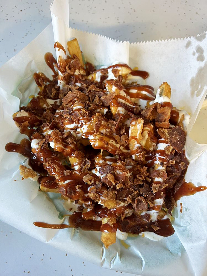 These loaded fries aren't just a side dish &ndash; they're a main event wrapped in bacon, drizzled with sauce, and crowned with crispy bits of heaven.