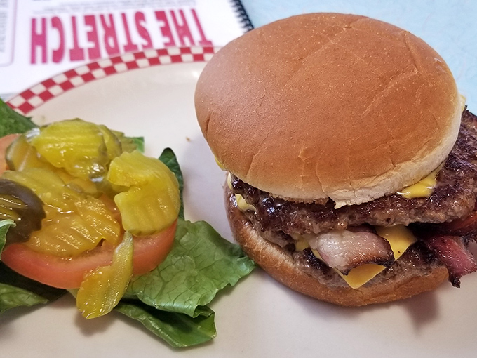 A burger that requires jaw exercises before attempting. Those pickles aren't just garnish&mdash;they're essential supporting characters in this meaty drama.